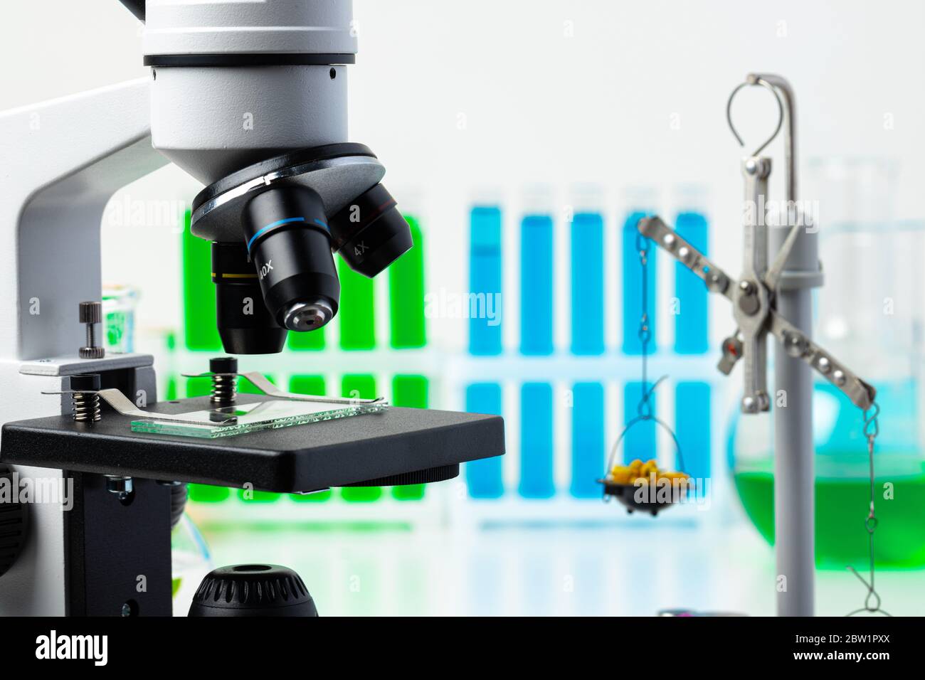 Medical laboratory. Scientific microscope with test tubes and plants ...