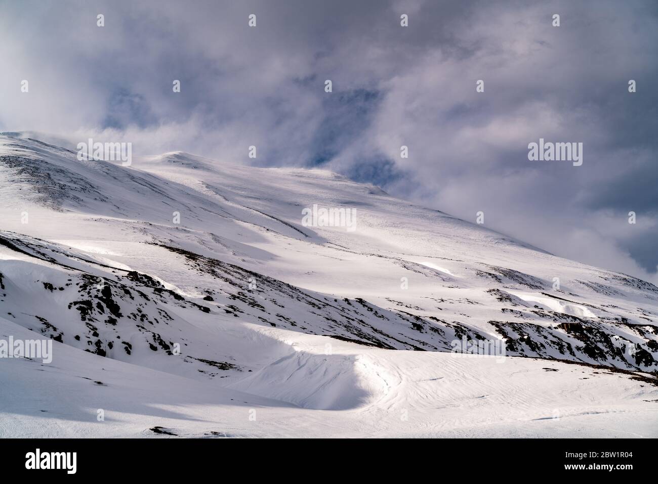 A smooth surfaced mountain discreetly finding its way towards the sky ...