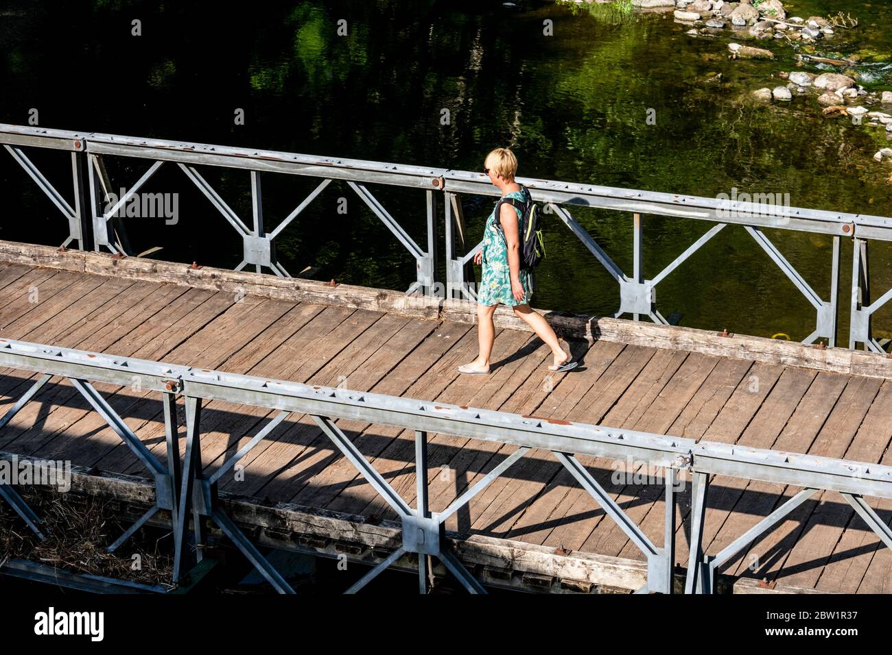 Female tourist walking over bridge hi-res stock photography and images ...