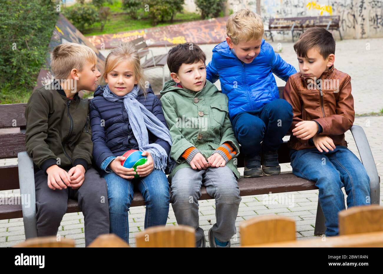 Kids playing ball together on the street Stock Photo - Alamy