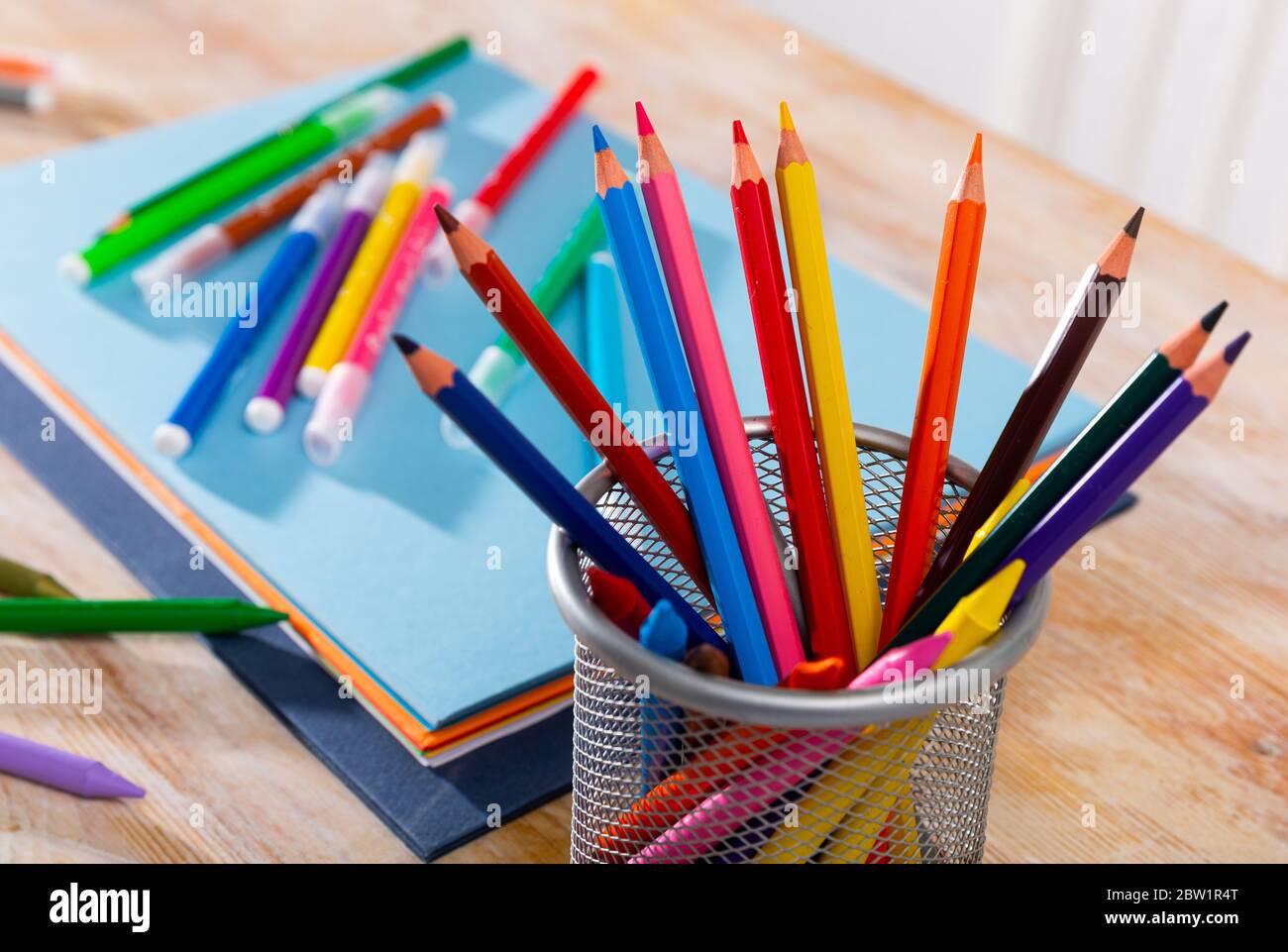 Colored pencils kept in pencil holder Stock Photo - Alamy