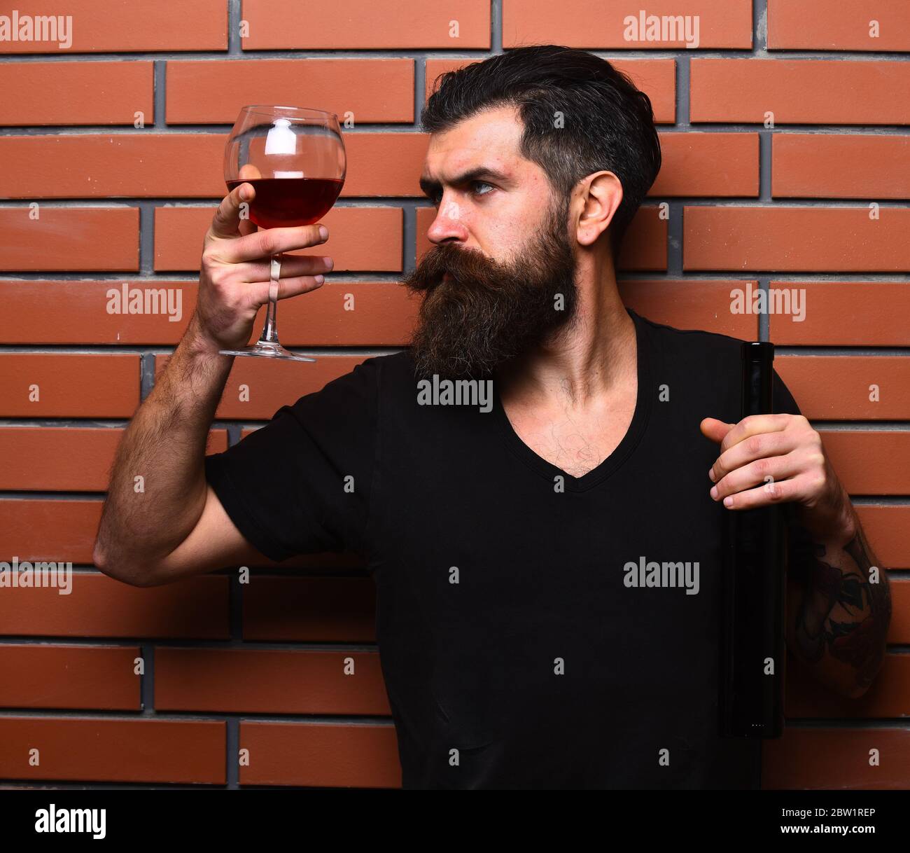 Bearded rich man with stylish hair and long beard in black fashion ...