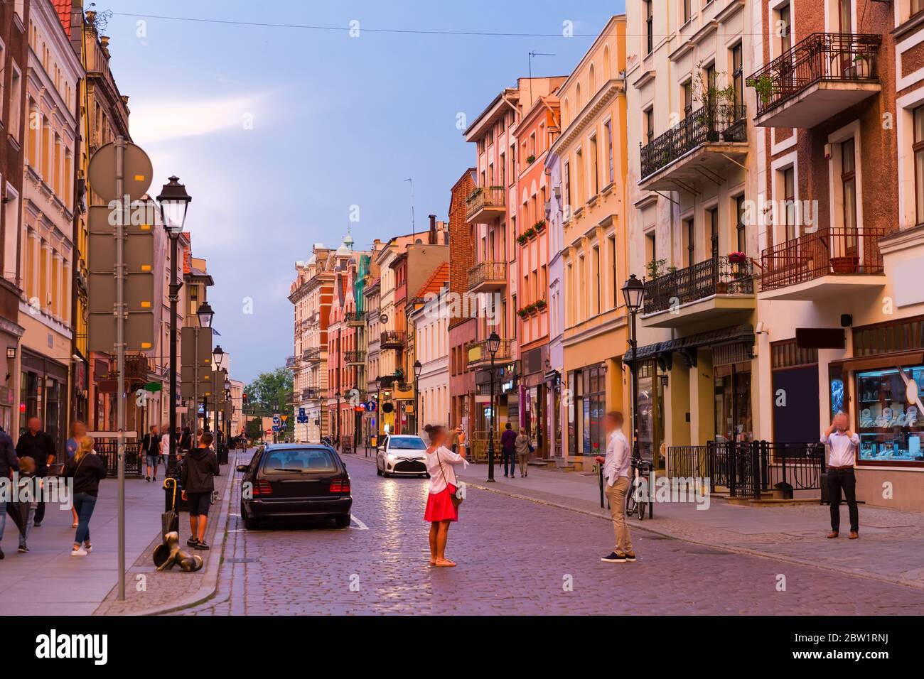 Nightlife of lighted Torun streets in warm spring, Poland Stock Photo ...