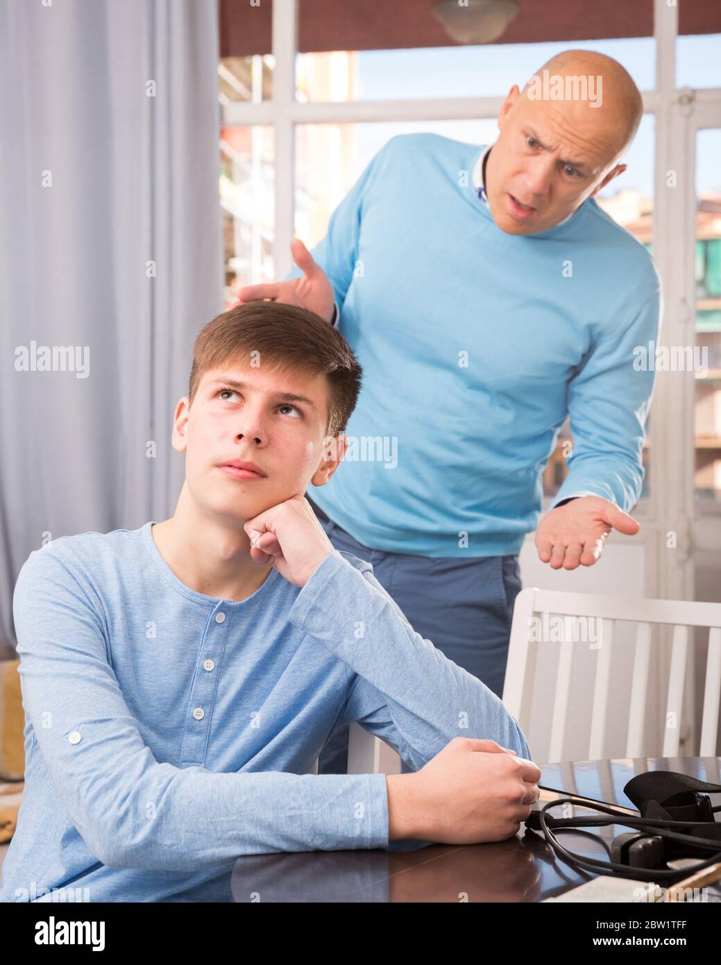 Portrait of angry father quarreling with his teenage son Stock Photo ...