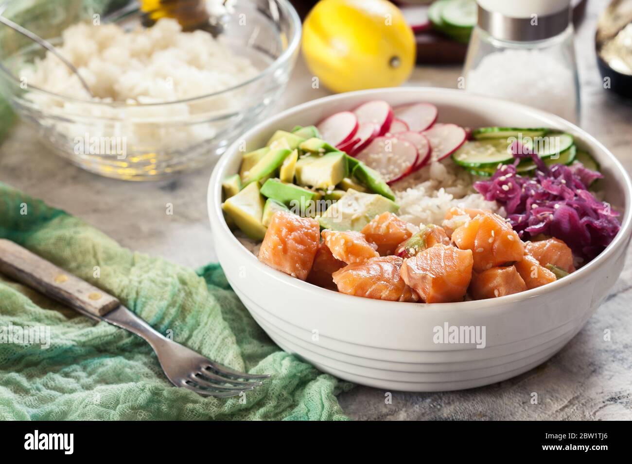 Poke bowl, traditional Hawaiian raw fish salad with rice, avocado ...