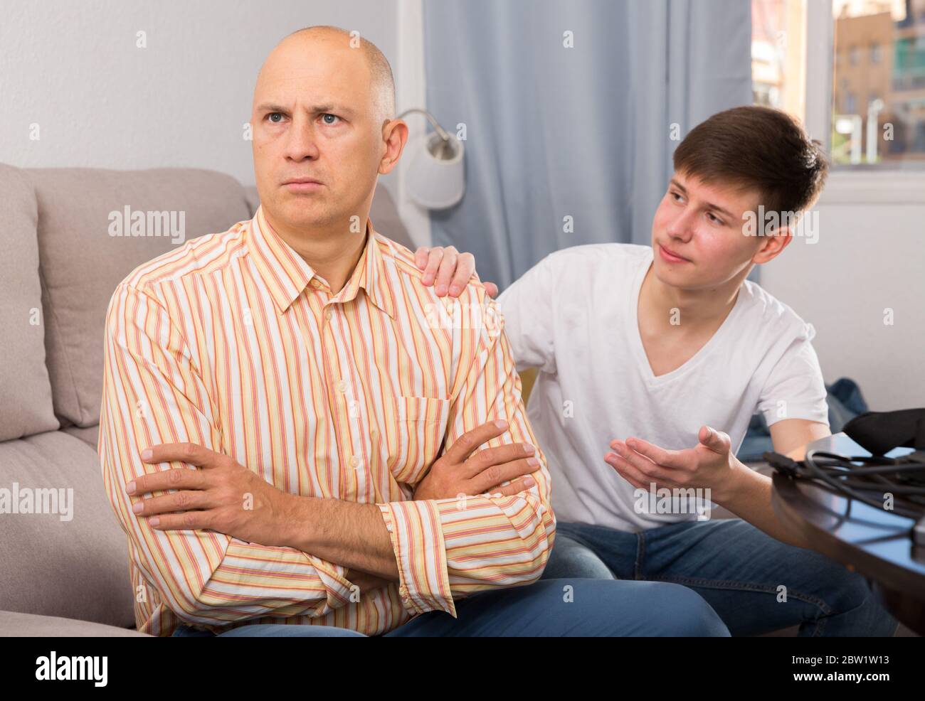Son apologize to father hi-res stock photography and images - Alamy