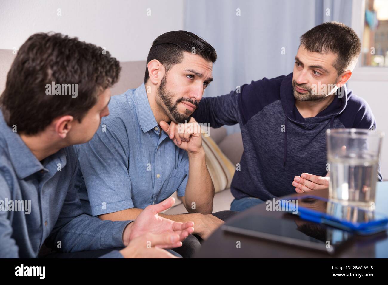 Two men talk sofa not female hi-res stock photography and images - Alamy