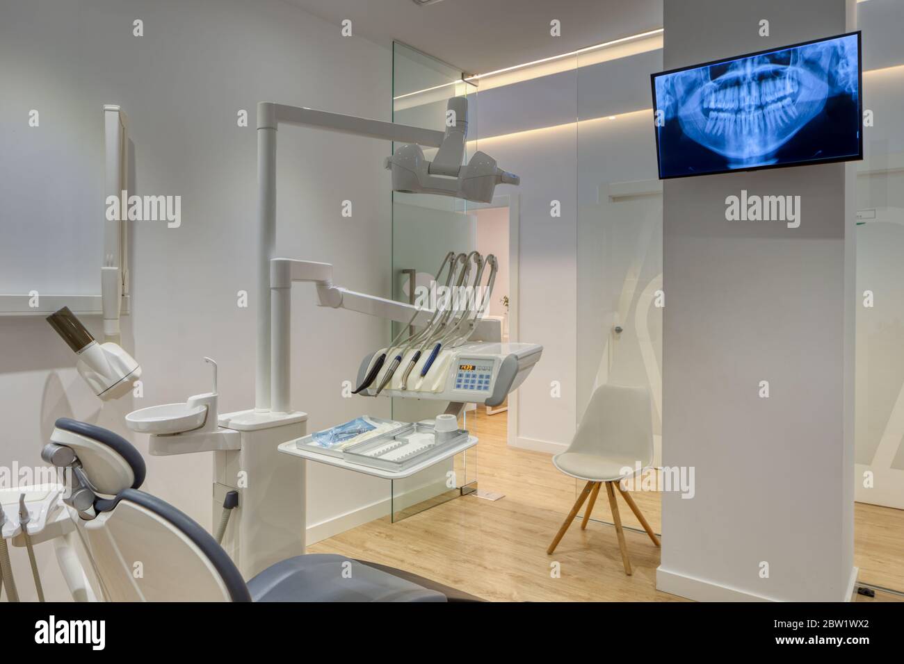 Fully equipped modern dental clinic box, with white walls and wooden ...