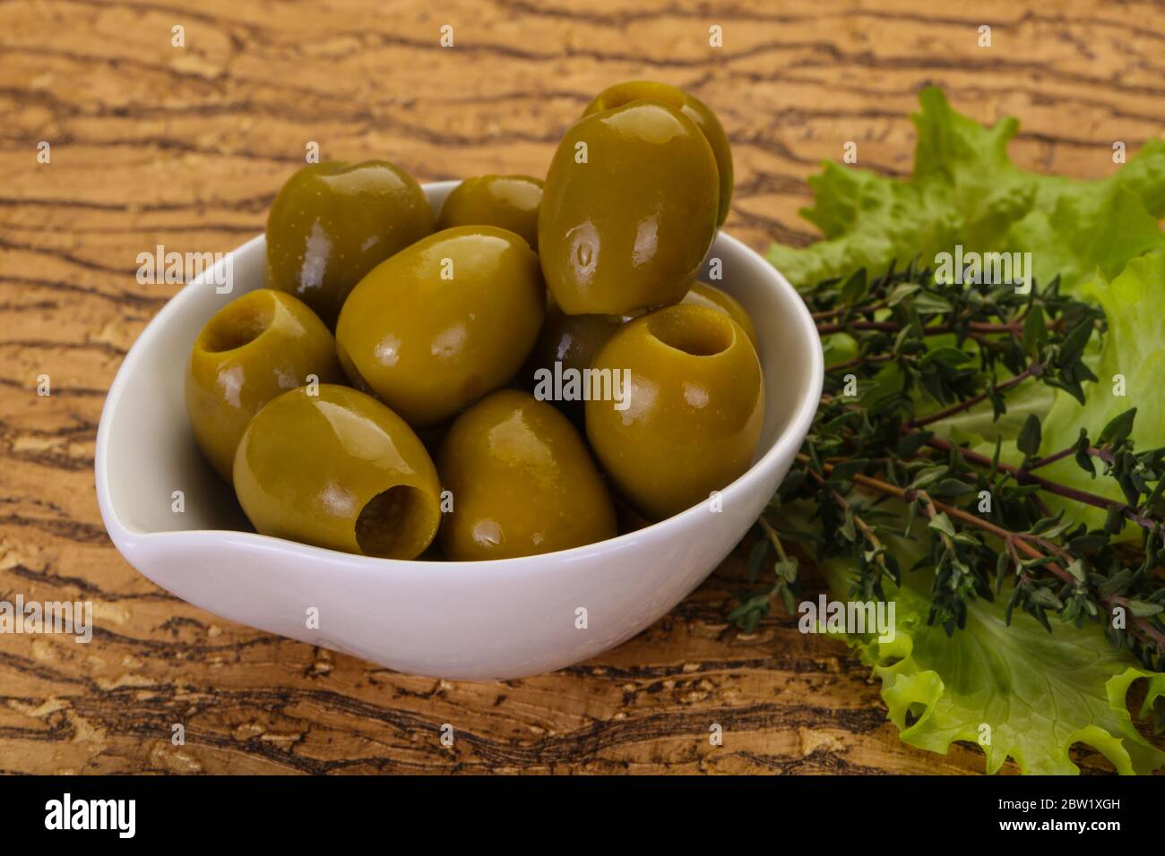 Big green olives in the bowl Stock Photo - Alamy