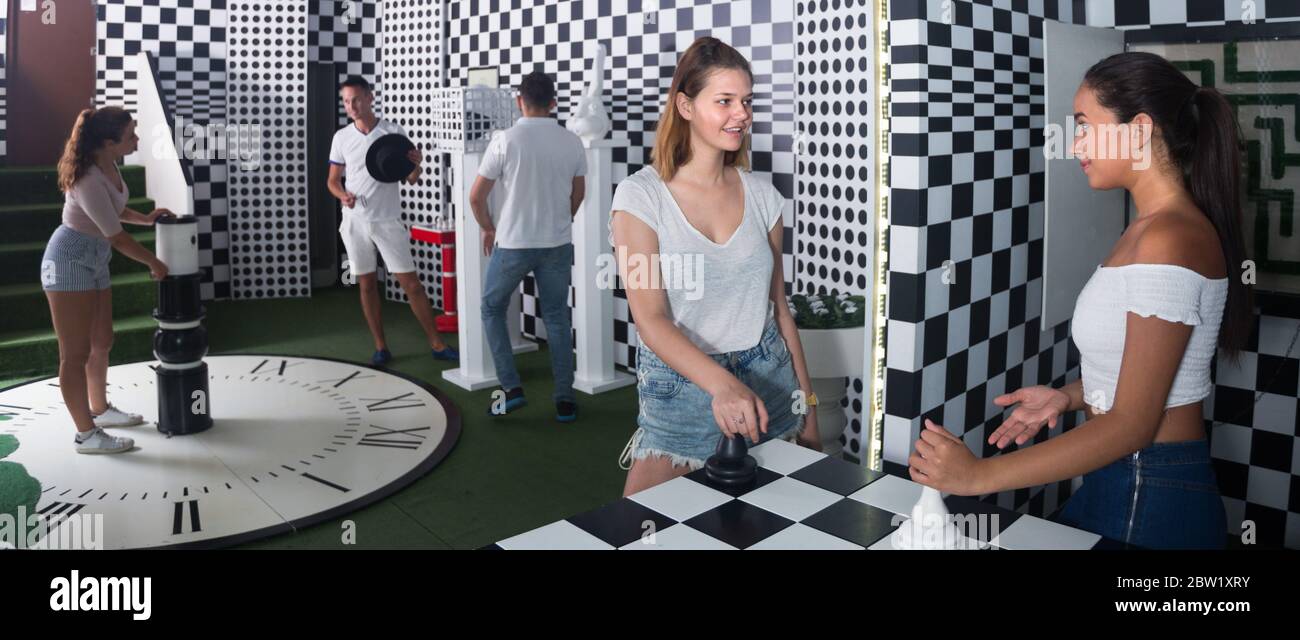 Group of friends are solving quests to get out of escape room stylized ...