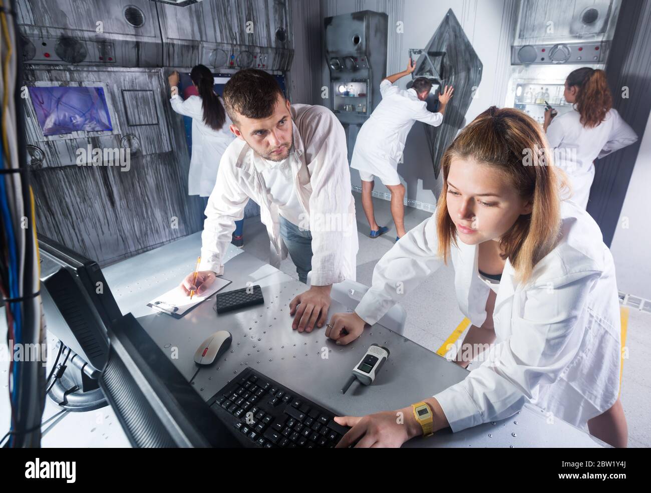 Group of adults trying to get out of escape room stylized under ...