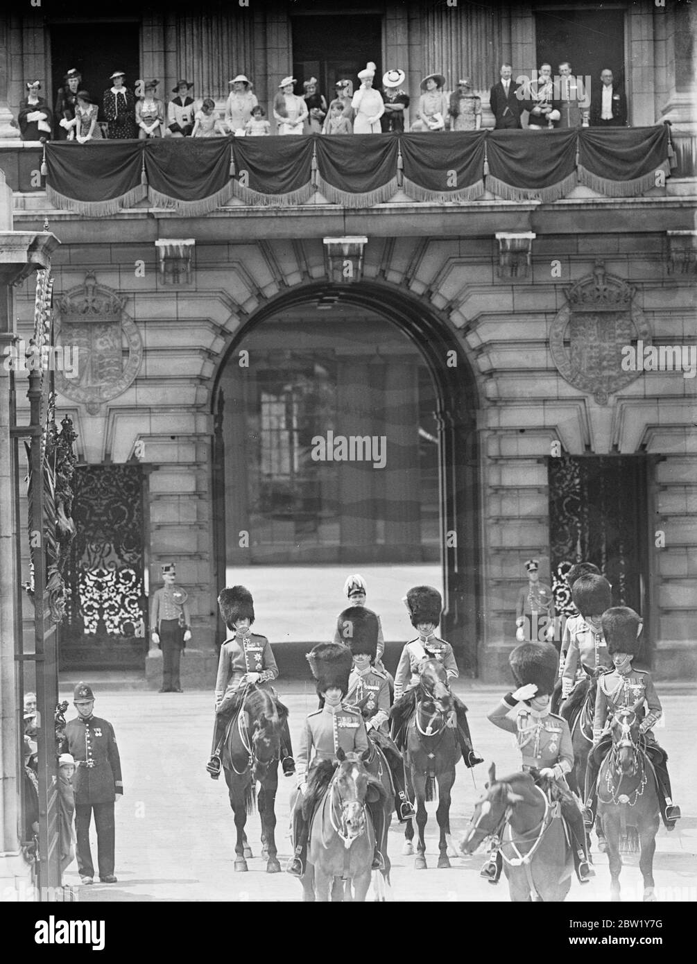 Royal family watch King takes salute at Buckingham Palace. For the ...