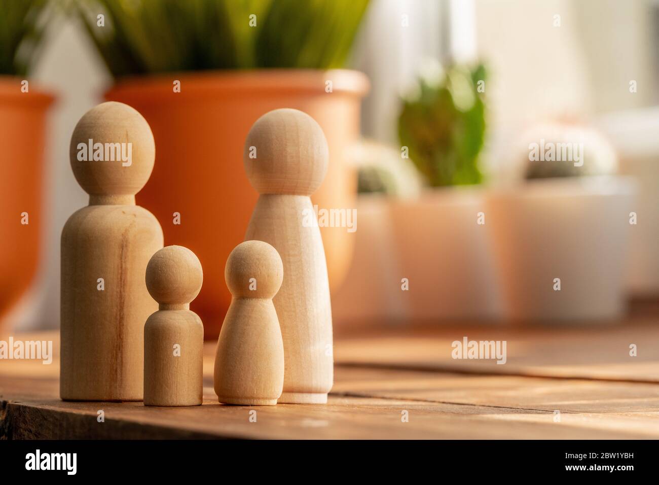 Small wooden figures of family members. Family relationship symbol ...