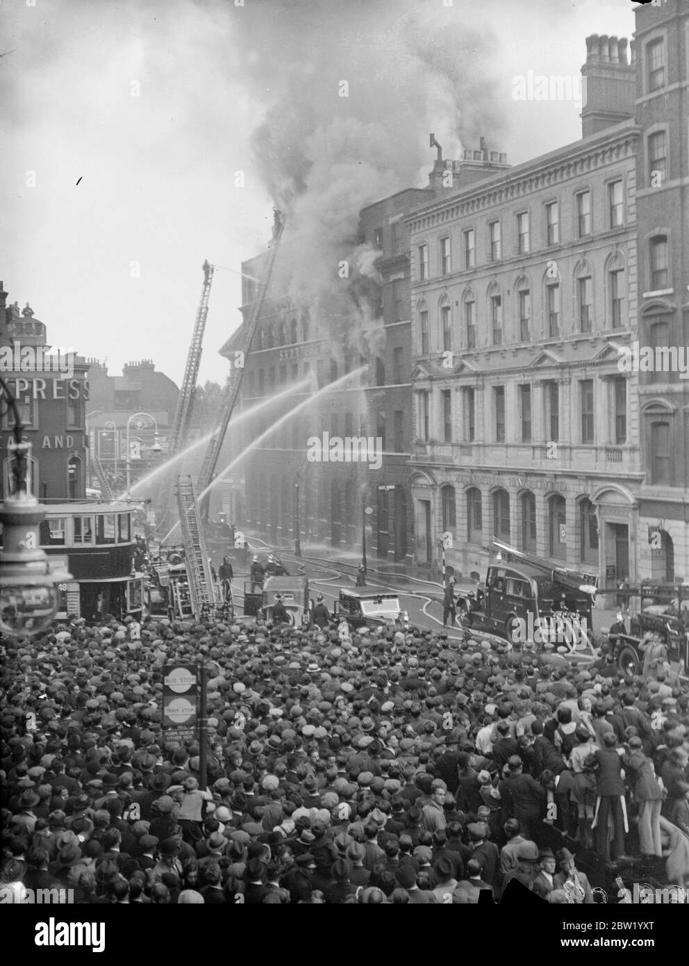 Elephant and Castle warehouse in flames, tremendous crowds watch. Fires ...