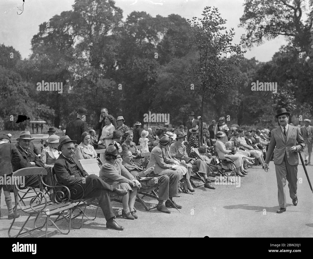Seats in the sun Black and White Stock Photos & Images - Alamy