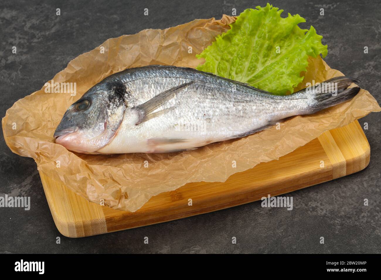 Raw Dorada fish ready for cooking Stock Photo - Alamy