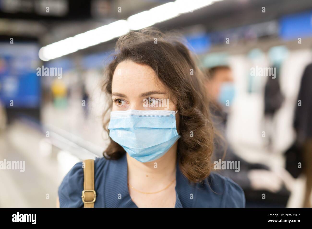 Portrait of female passenger in disposable face mask and latex gloves ...