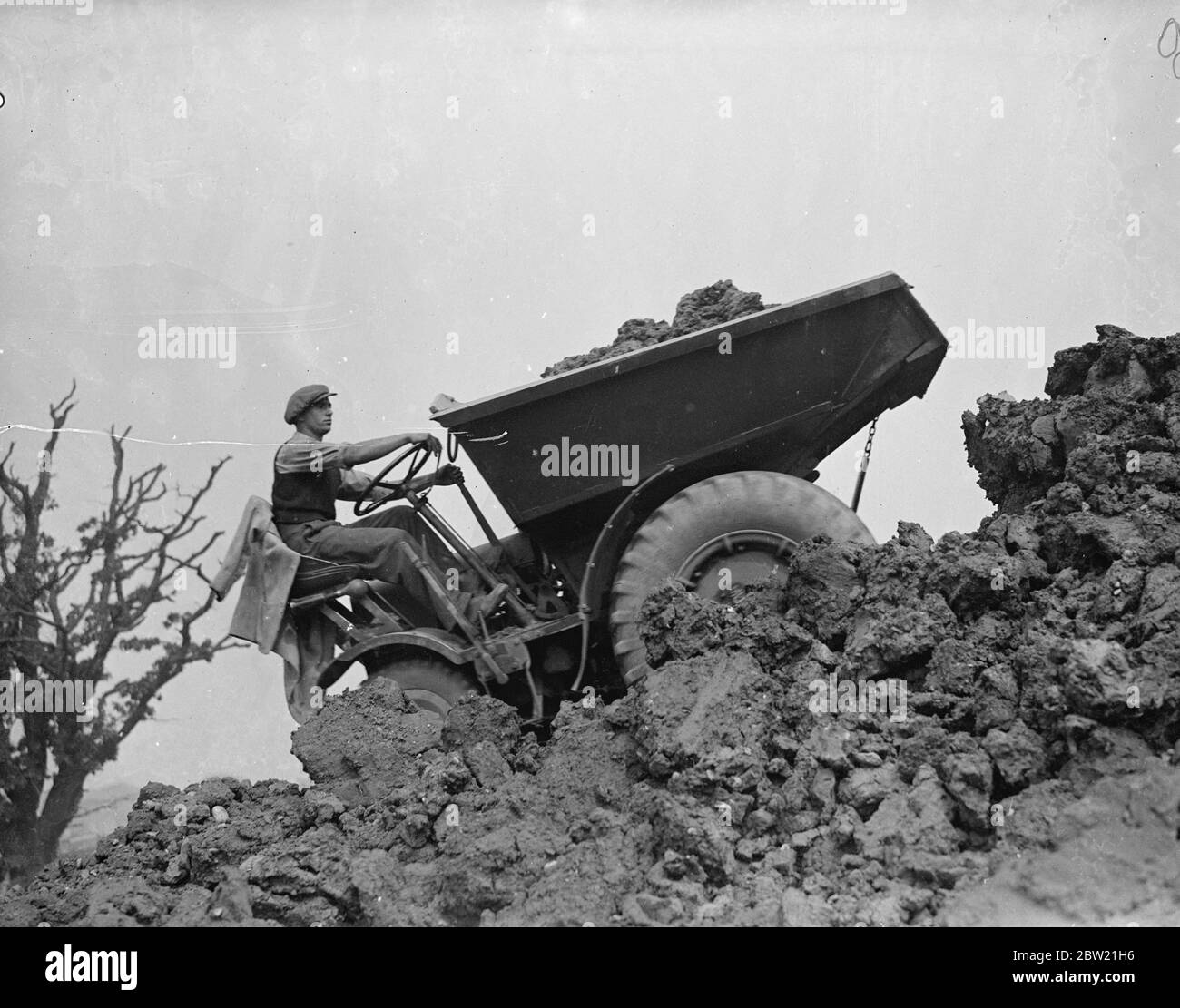A mechanical navvy carrying away the spoil during the excavations on ...