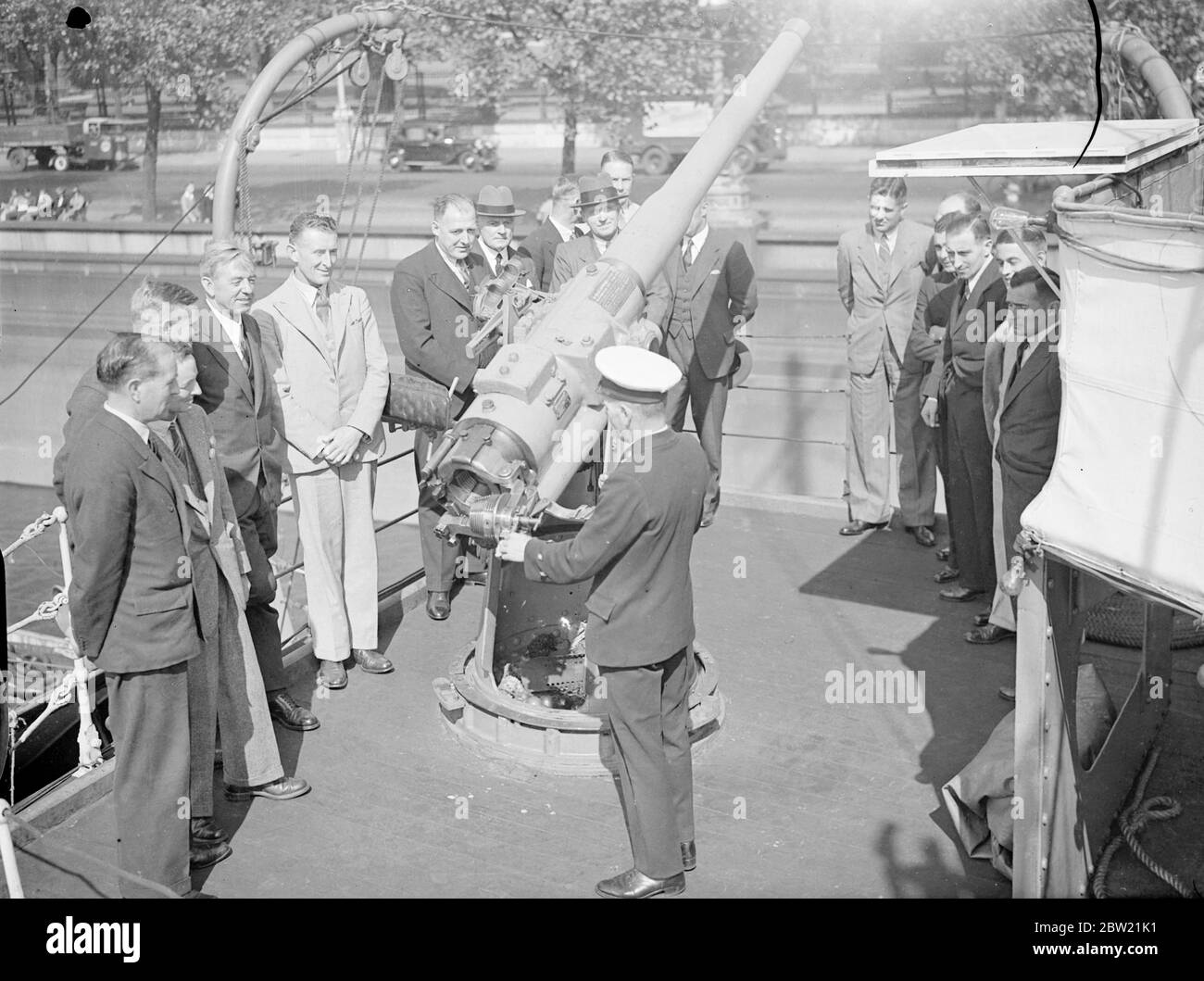 Chief gunners mate A.V Gray giving instruction to masters of the ...
