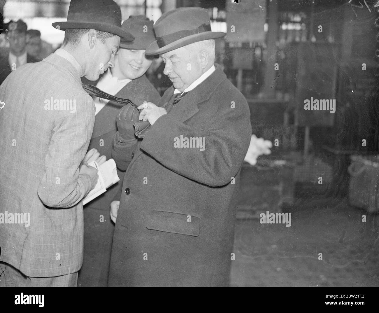 Lord Hewitt, the lord chief justice examining the tie of Mr Stanley ...