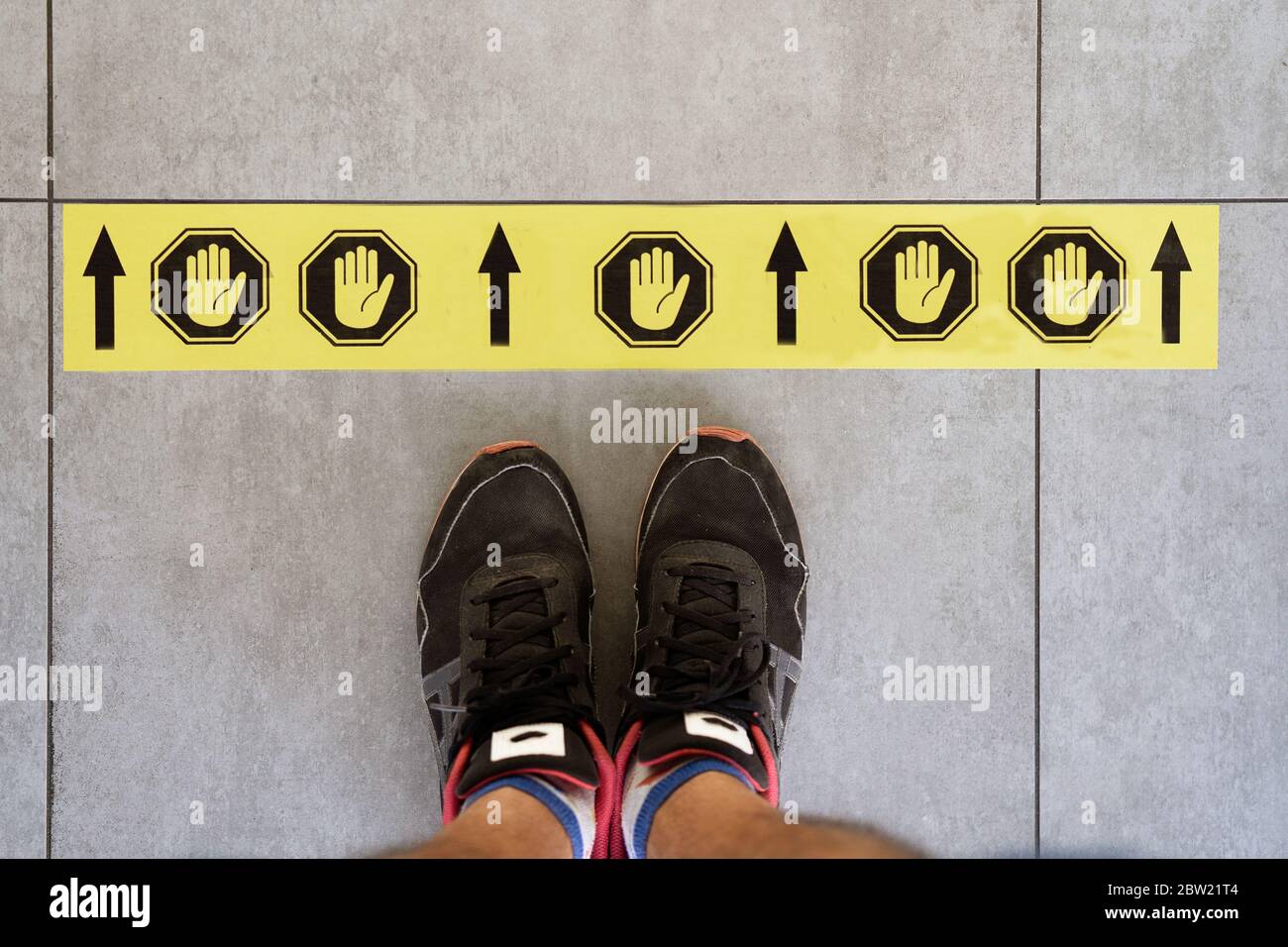 Maintain Social Distancing in yellow Waiting line attached in the ...