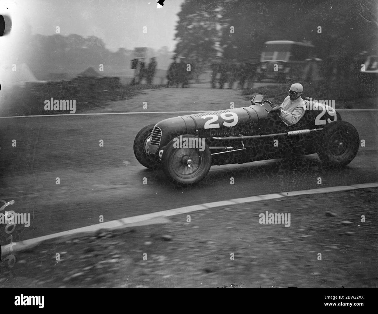 Count Trossi speeding round the track in his Maserati. Famous British ...