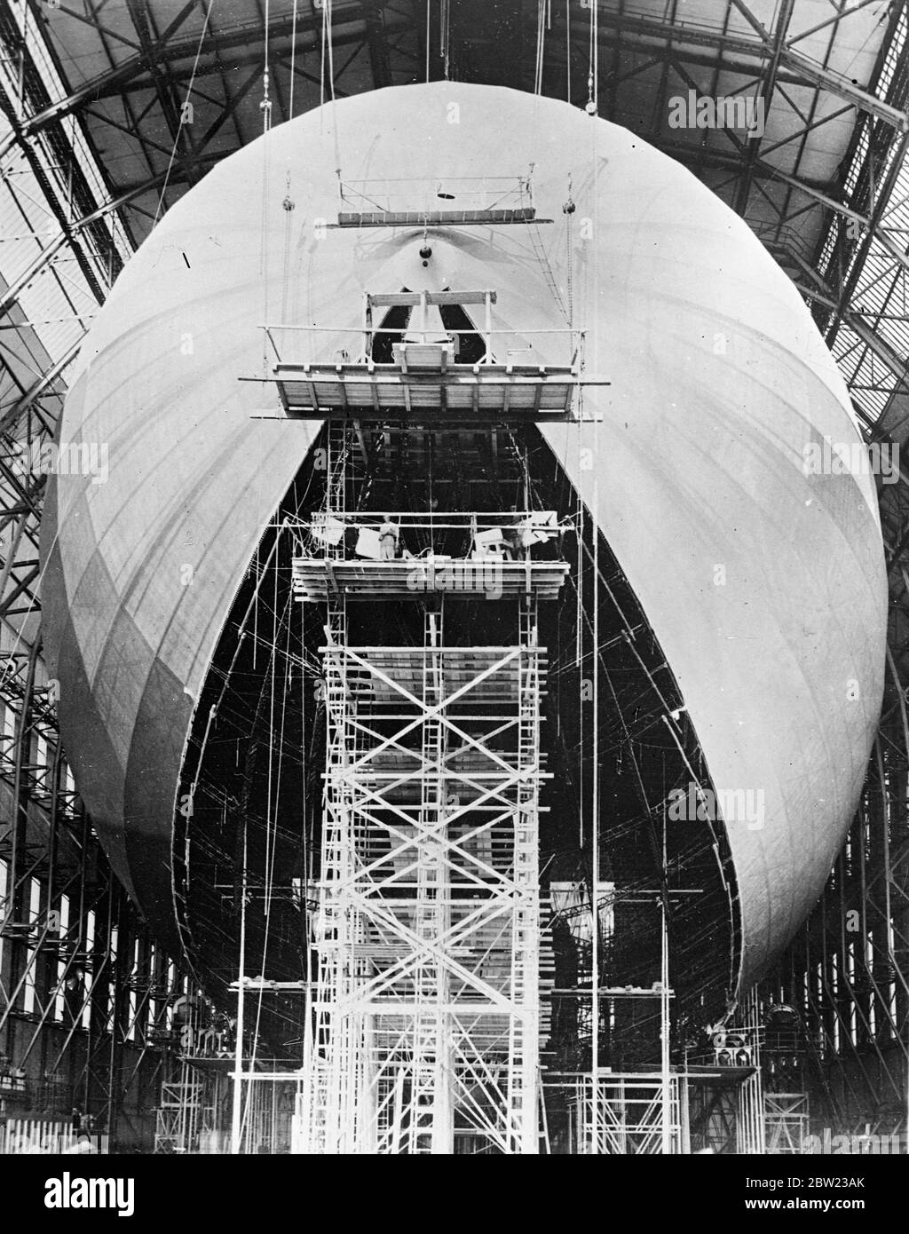Engineers at work on the last part of the nose of the new German ...