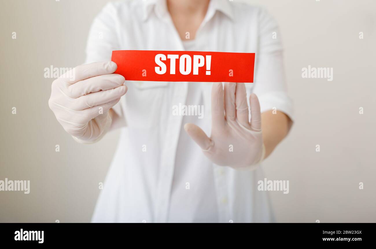 Coronavirus quarantine, red warning sign with text Stop, doctor show ...