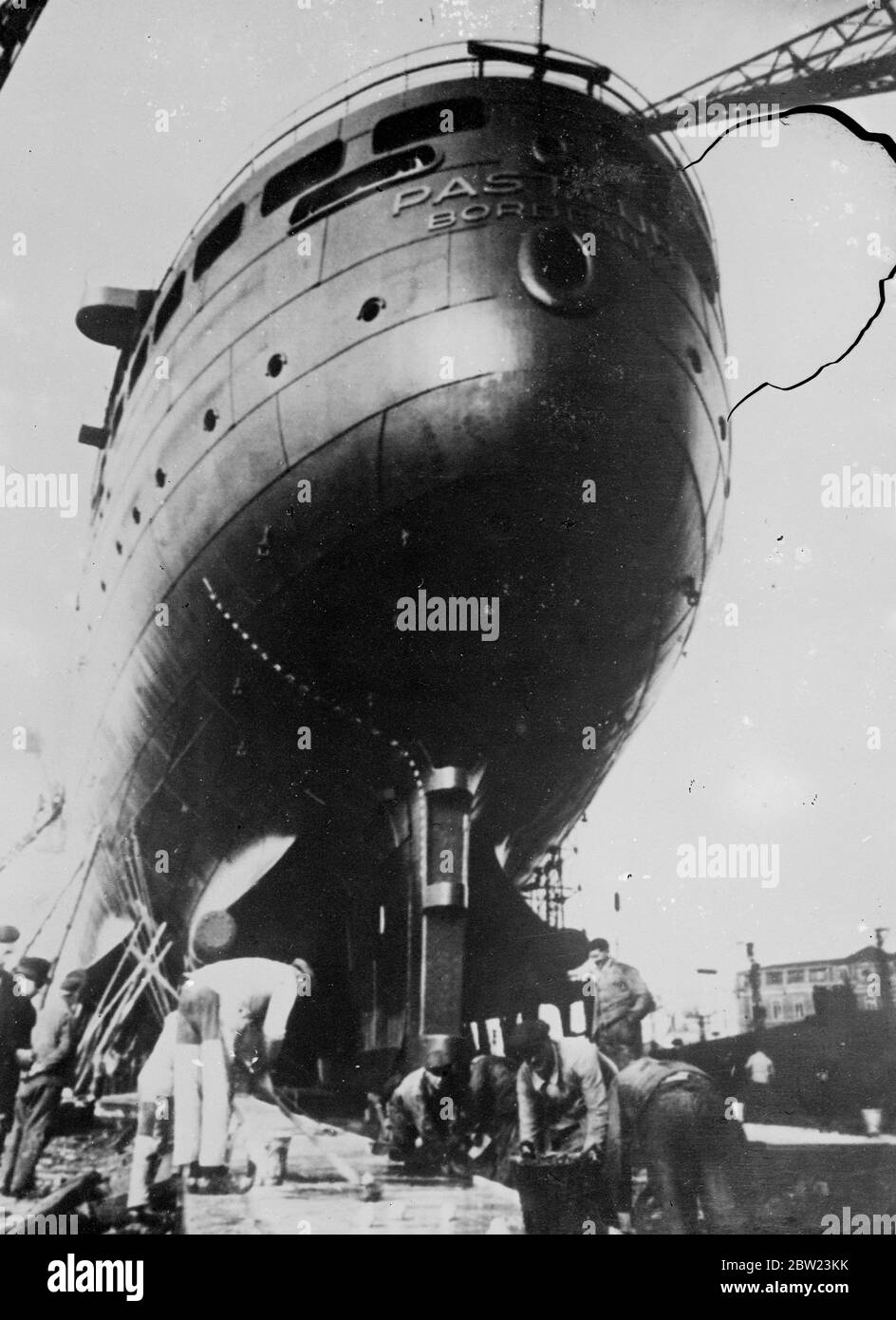 Smoothing the way for France's new giant liner. Greasing the slipway ...