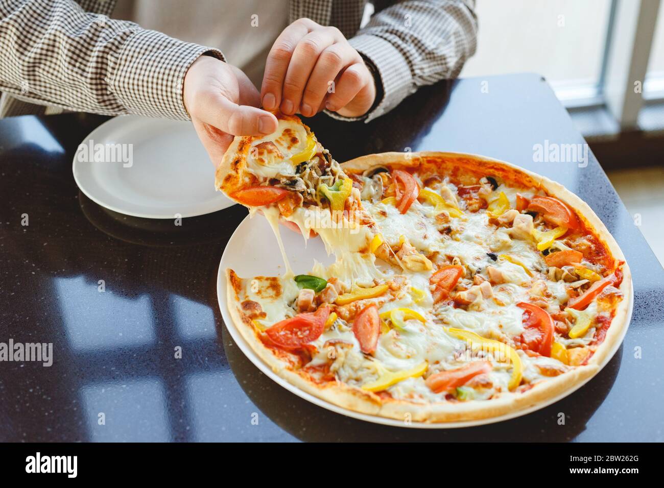 Eating pizza at home. Delicious pizza delivery. Caucasian man take ...