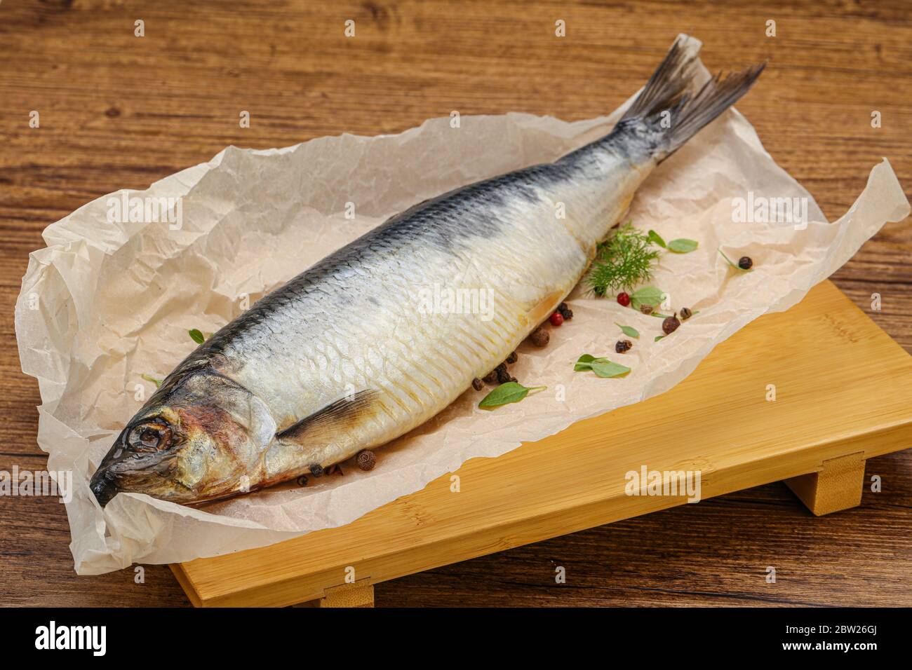 Salted Herring fish with pepper and spices Stock Photo - Alamy