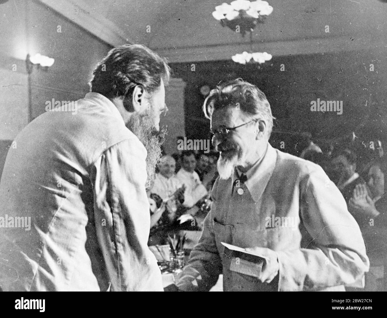 Professor Otto J. Schmidt (left) receiving the Order of Lenin and ...