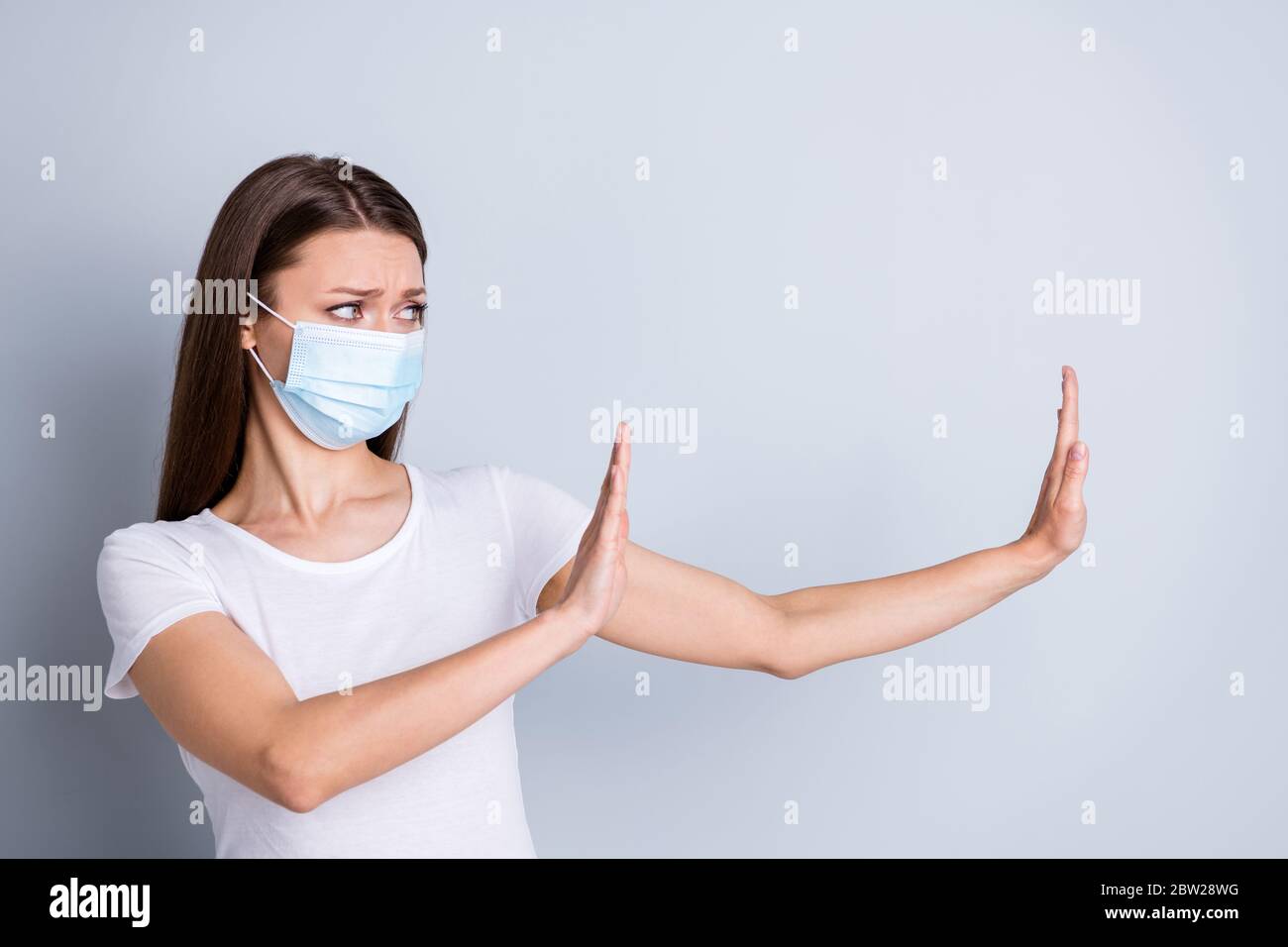 Photo of serious lady keep social distance avoid afraid of people ...