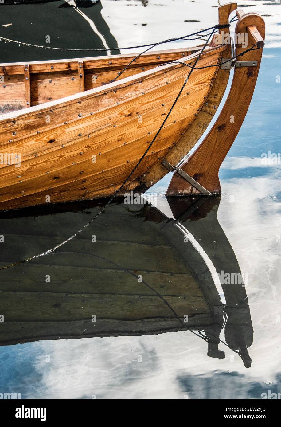 wooden fishing boat mirror sea Stock Photo - Alamy