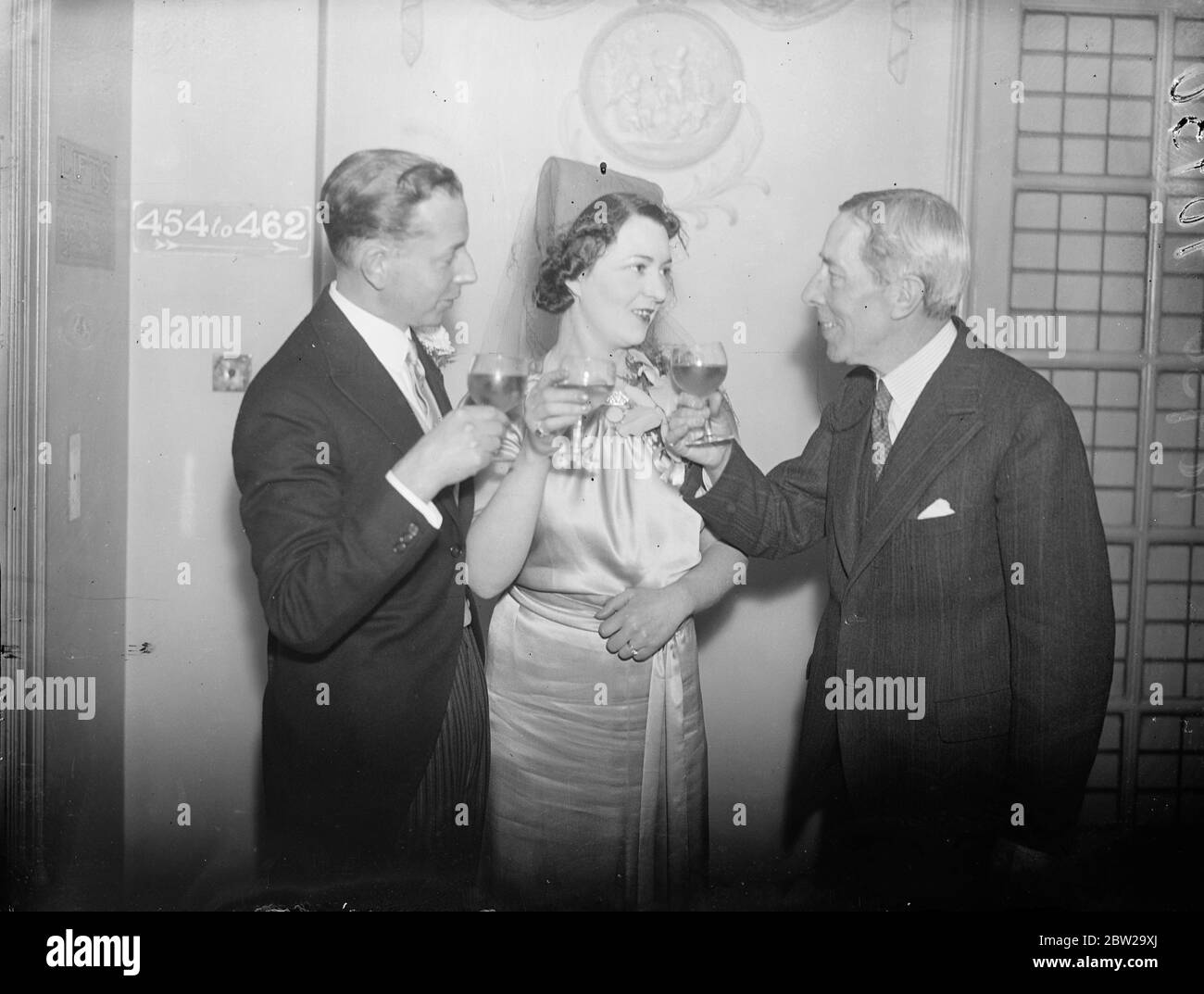 George Arliss toast the bridegroom, his nephew and bride. George Arliss ...