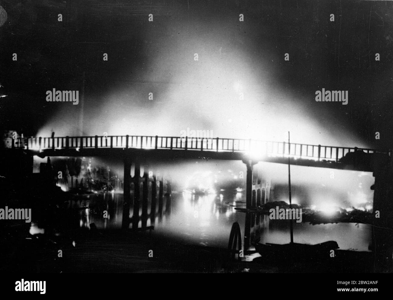 Chinese, retreating in junks, fire a bridge. Making desperate efforts ...