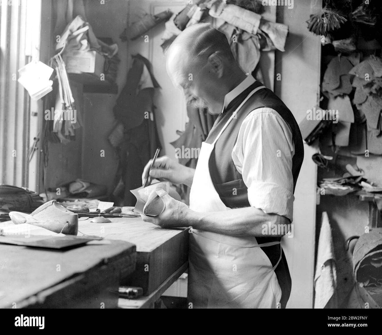 Shoe cobbler Black and White Stock Photos & Images - Alamy