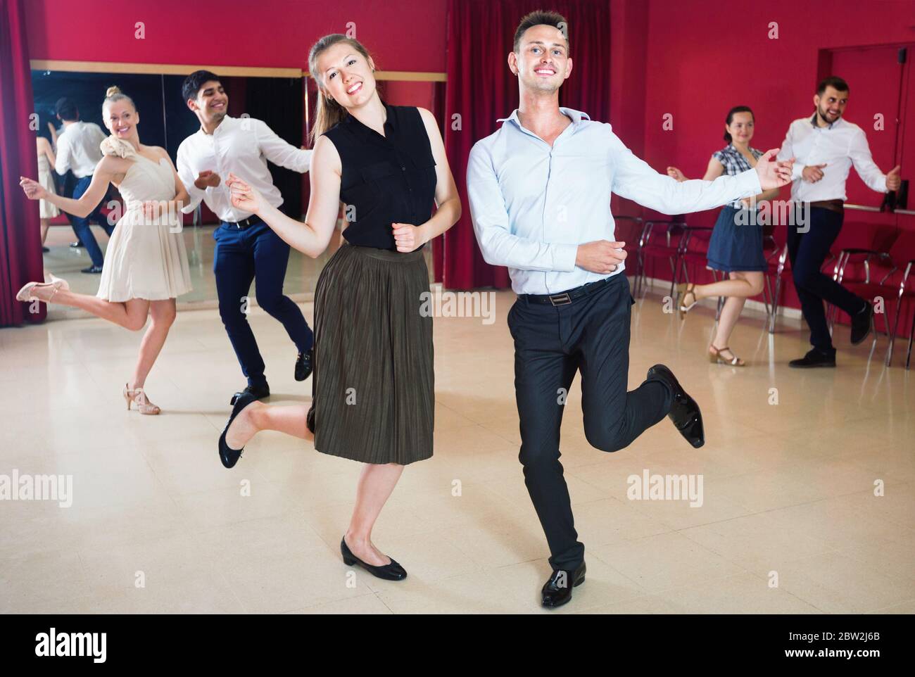 Young happy cheerful positive people dancing twist in pairs Stock Photo ...
