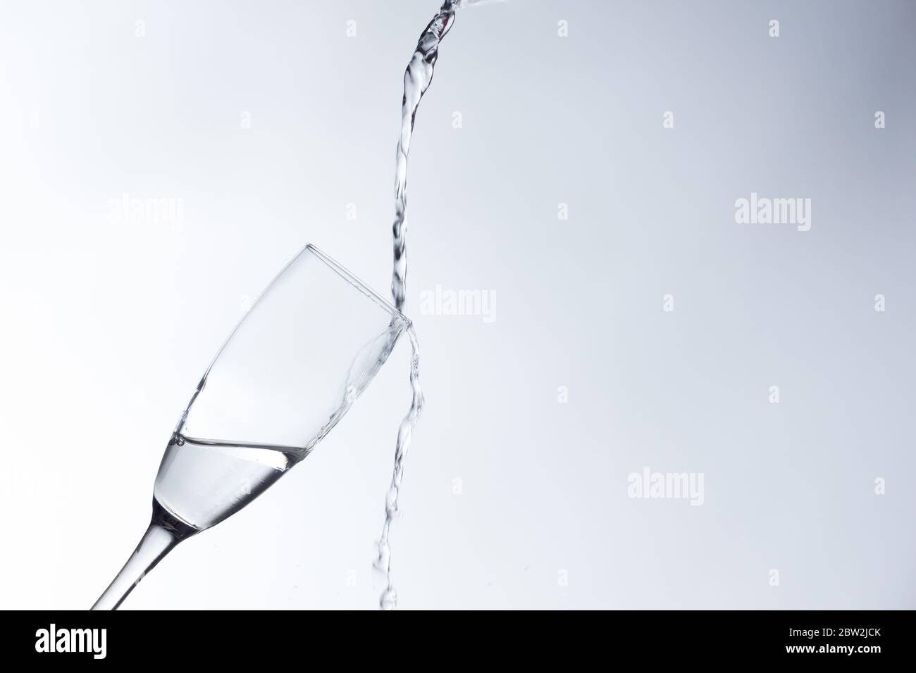 Clear, drinking water falls into a clear glass, healthy, wholesome ...