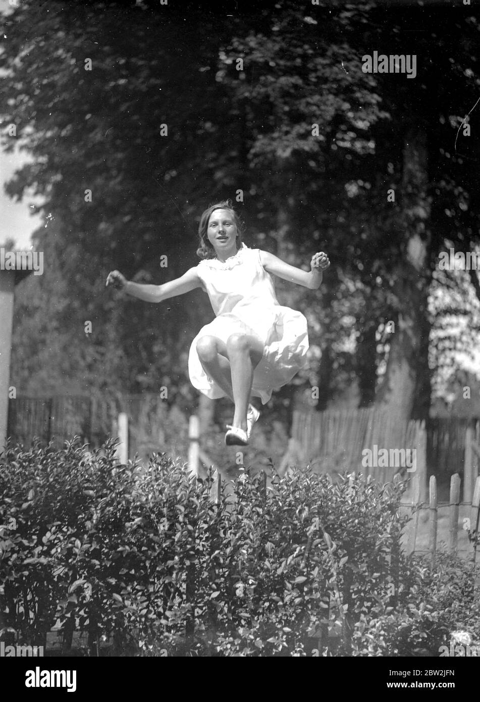 Happy child girl jumping Black and White Stock Photos & Images - Alamy