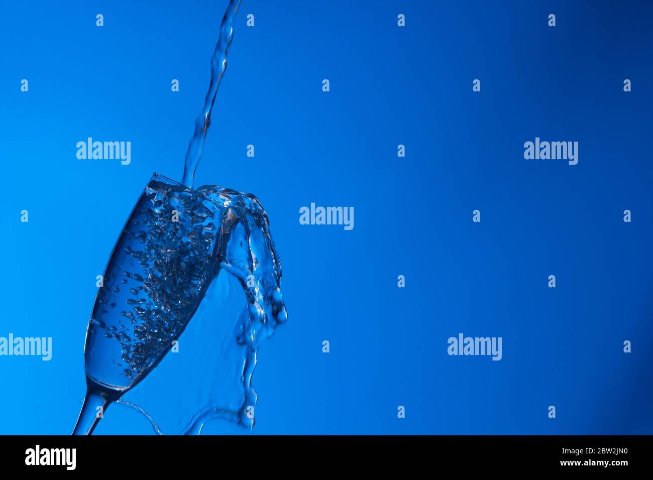 Clear, drinking water falls into a clear glass, healthy, wholesome ...