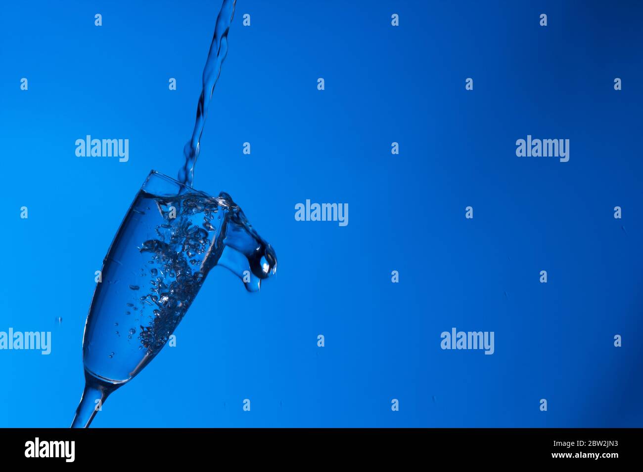 Clear, drinking water falls into a clear glass, healthy, wholesome ...