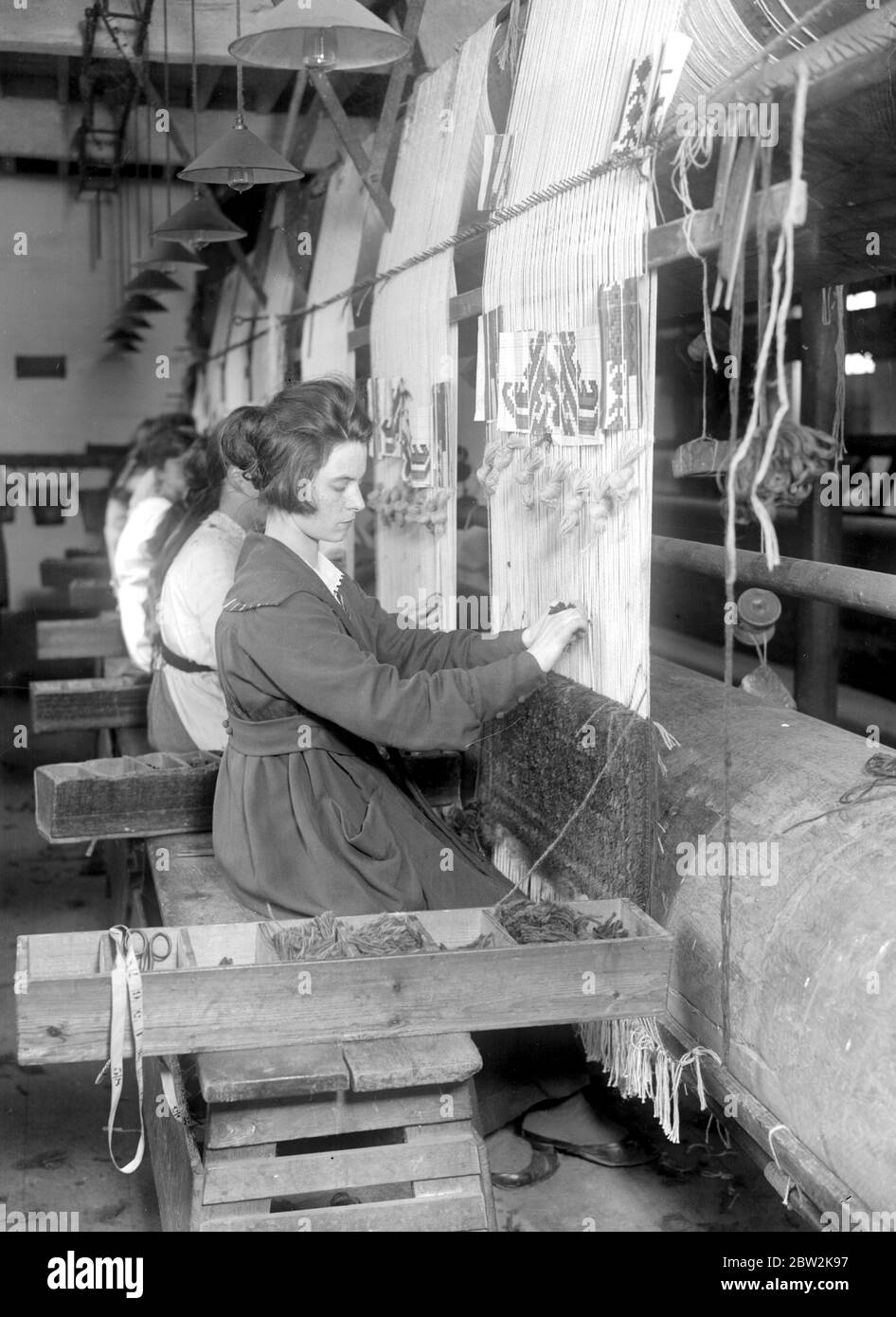 Carpet making at Wilton . Weaving a handmade real Axminster carpet . 1 ...