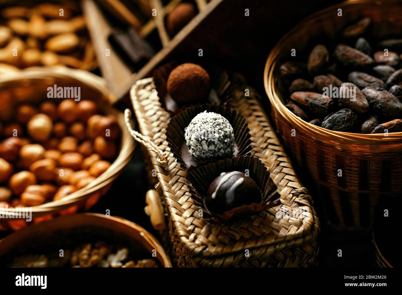 Handmade different candies inside of candy wrapper stand on wicker ...