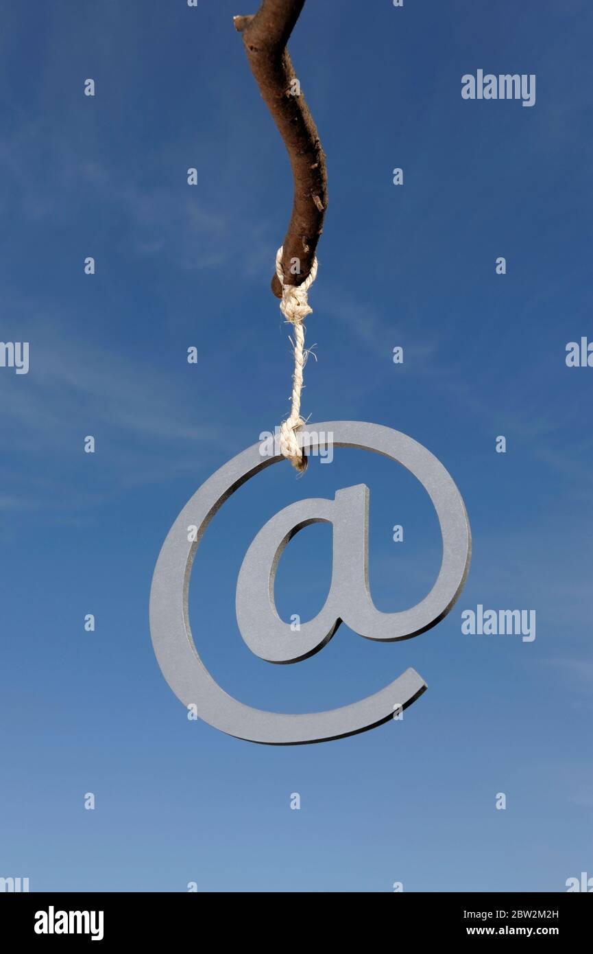 An at symbol hanging from a stick Stock Photo - Alamy