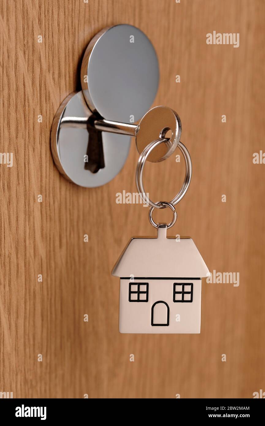 House key in door keyring hi-res stock photography and images - Alamy