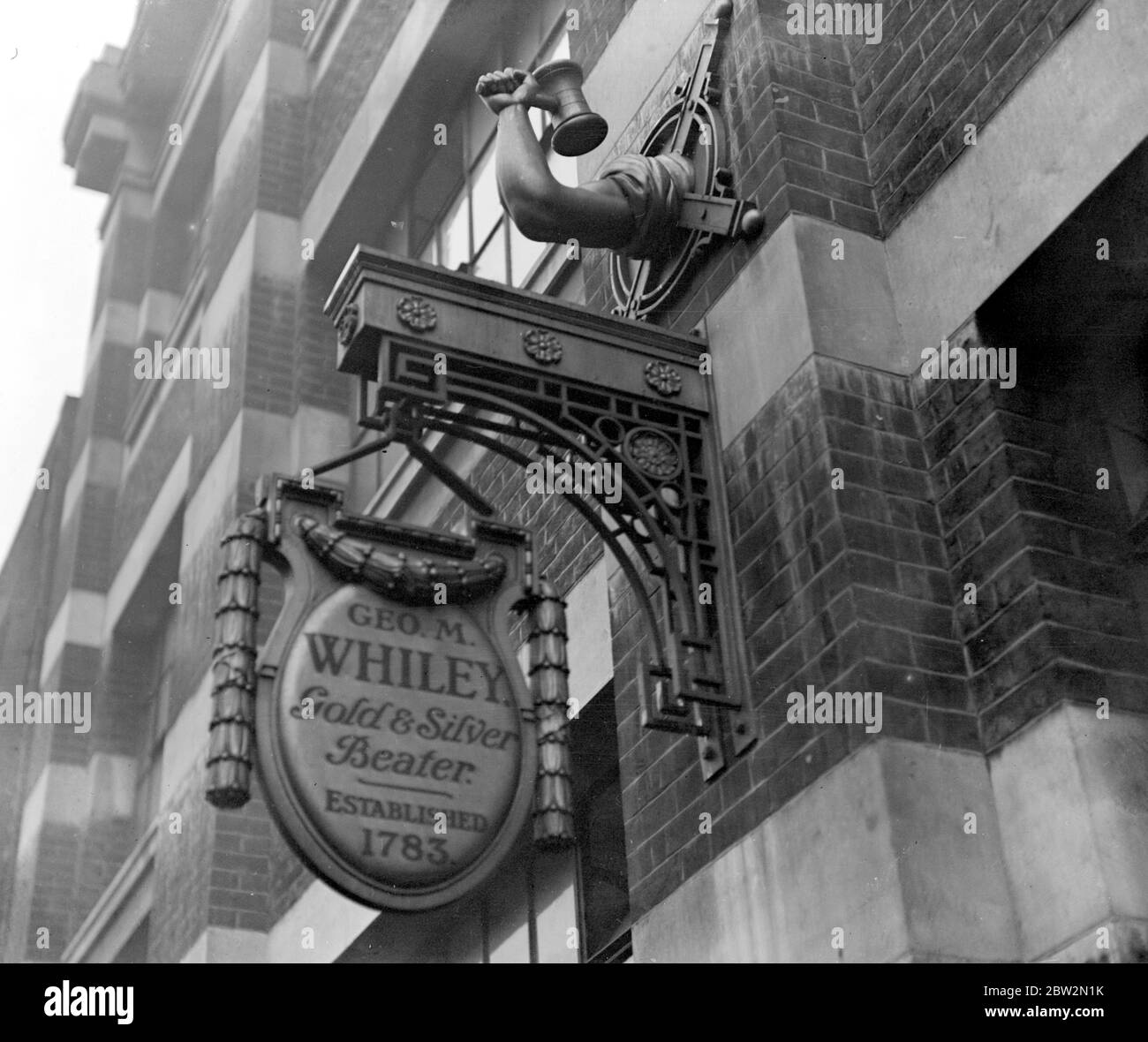 Gold beating Black and White Stock Photos & Images - Alamy
