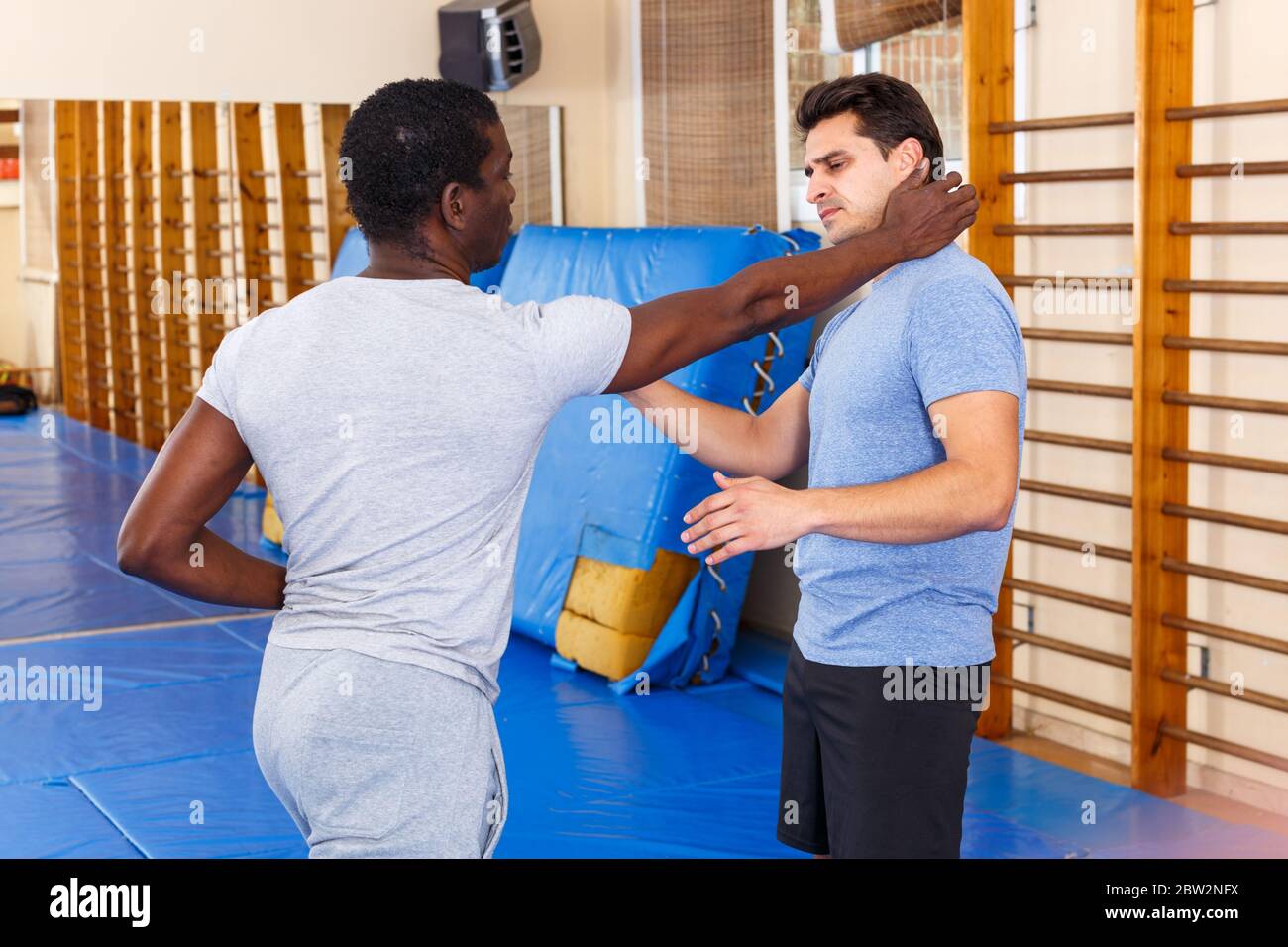 Males training attack movements in pair at self protection workout ...