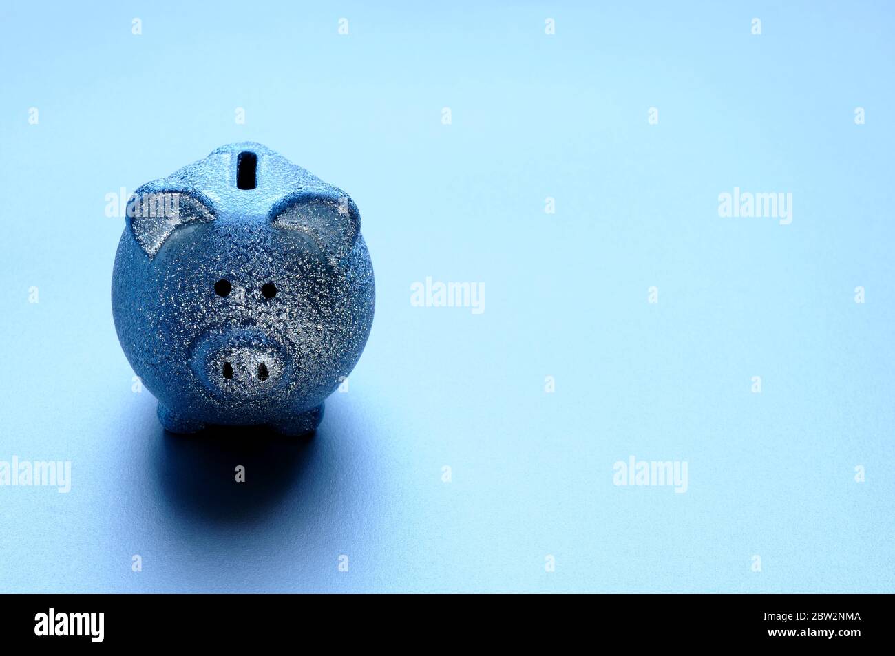 A blue metallic piggy bank Stock Photo - Alamy