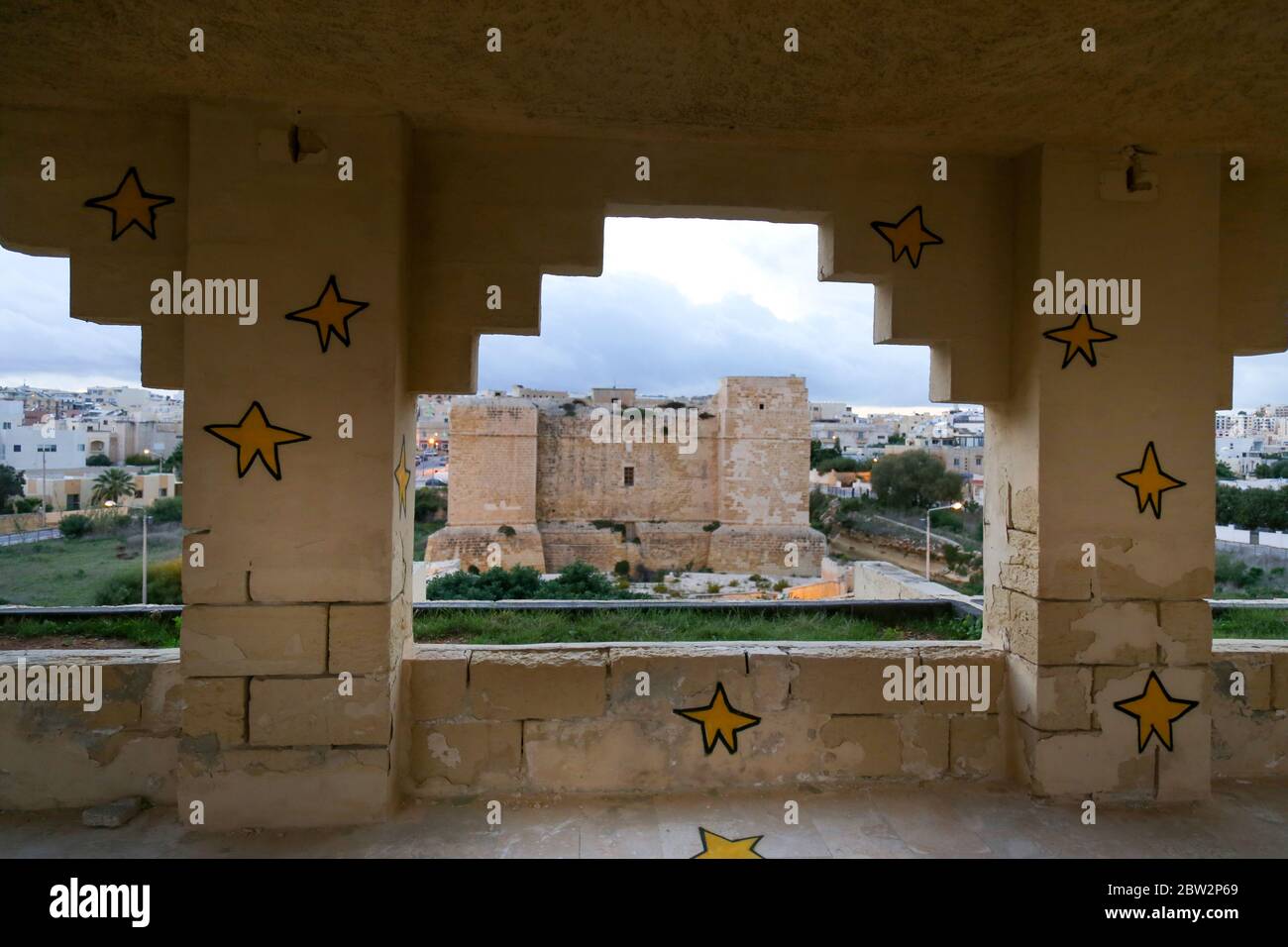 View of the St. Thomas Tower through the arc of a building in ...